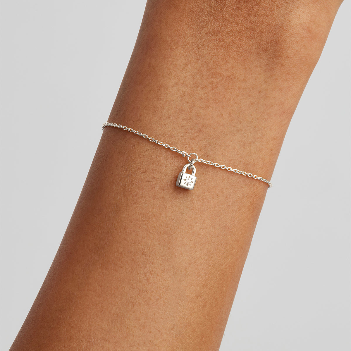 Sterling Silver Crystal Lotus Padlock Bracelet – by charlotte